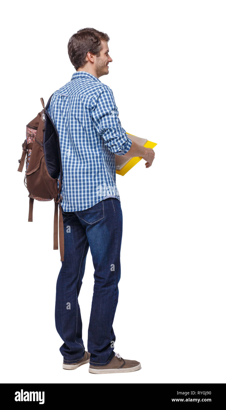 Back view of a student. guy with the backpack and textbooks. Rear view ...