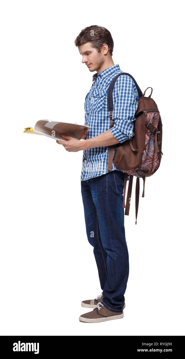Side view of a student. guy with the backpack and textbooks. Rear view ...