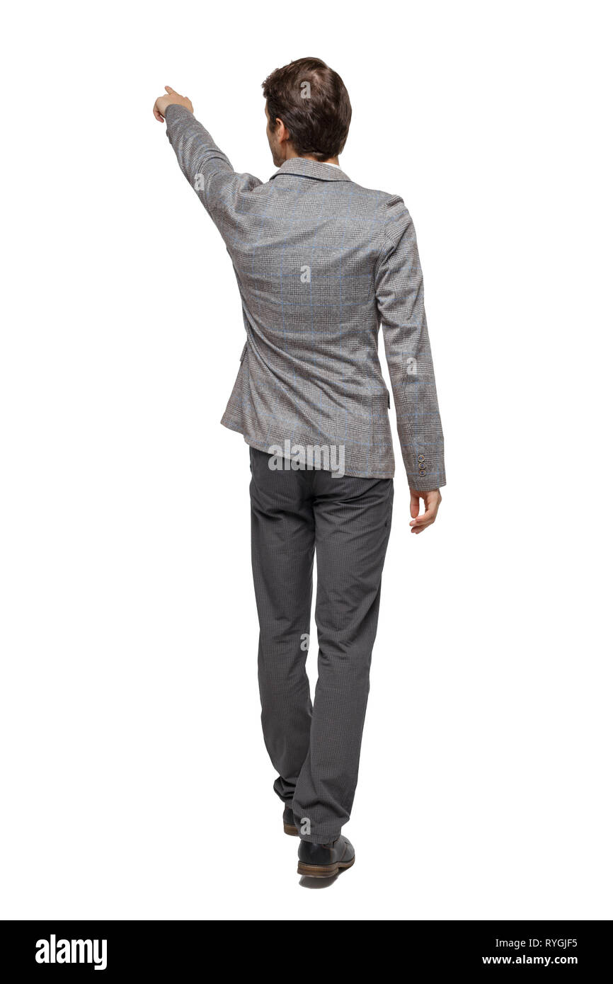 Back view of walking pointing business man. gesticulating young guy in ...
