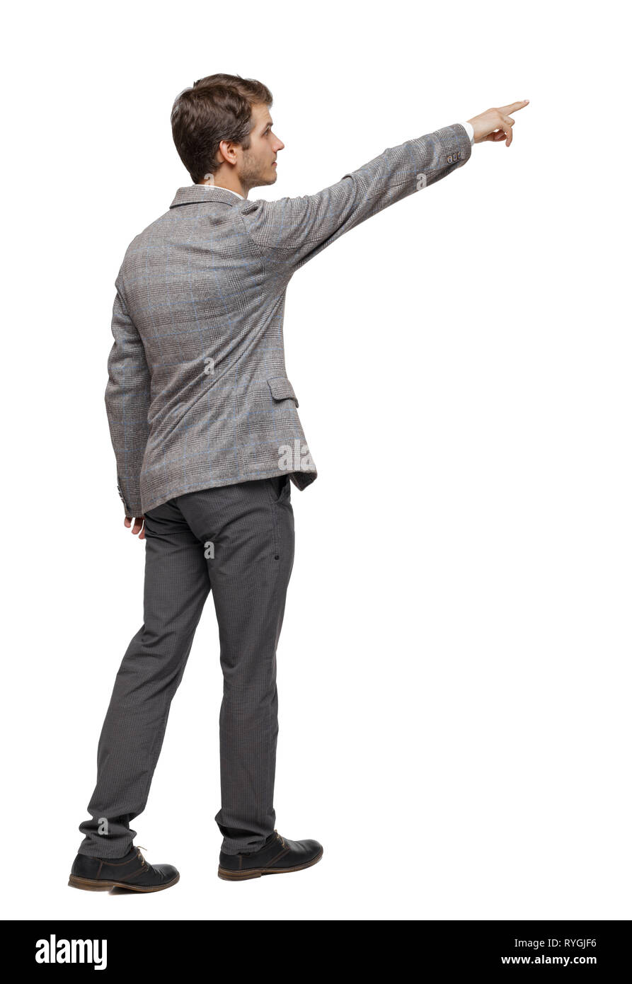 Back view of walking pointing business man. gesticulating young guy in ...