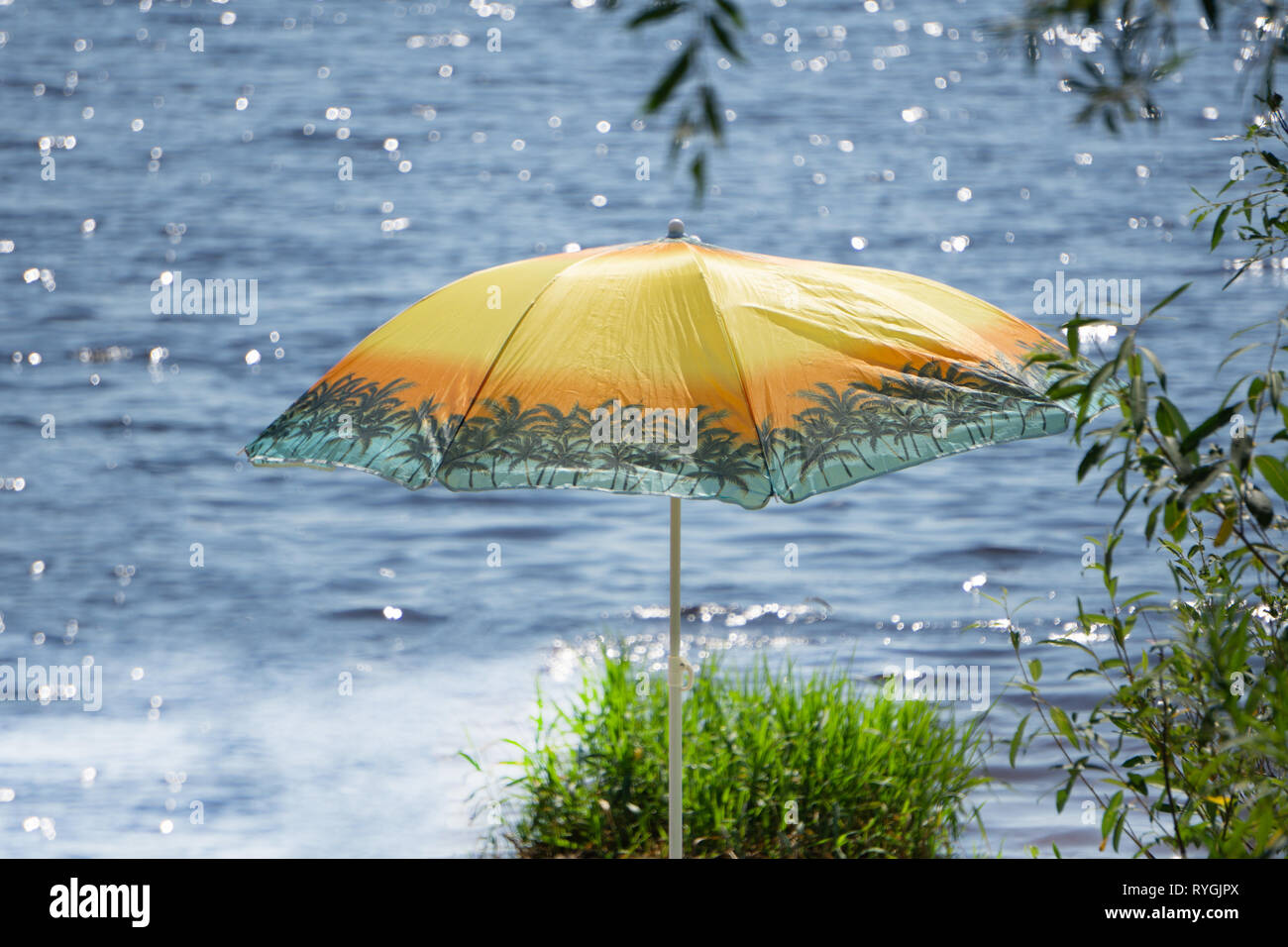 Beach on the tropical island. beach beds and umbrellas. Under the shade ...
