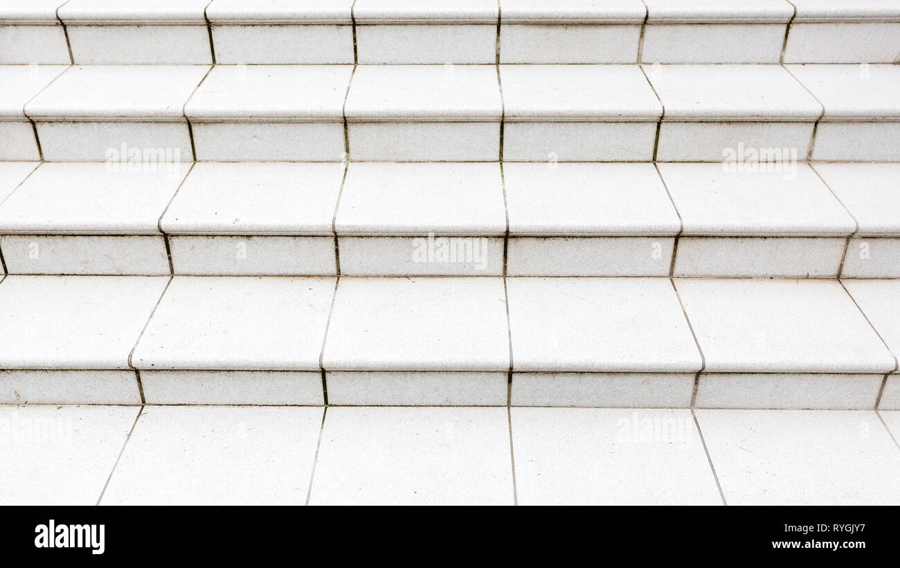 Marble stone granite white stairs. Textured background. Close up image ...