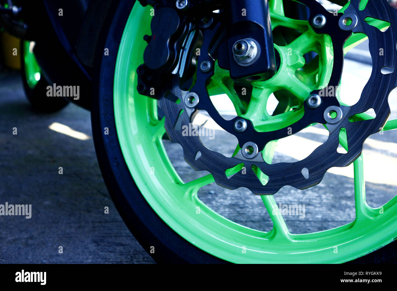 Photo of a disc brake on the front tire of a motorcycle Stock Photo - Alamy