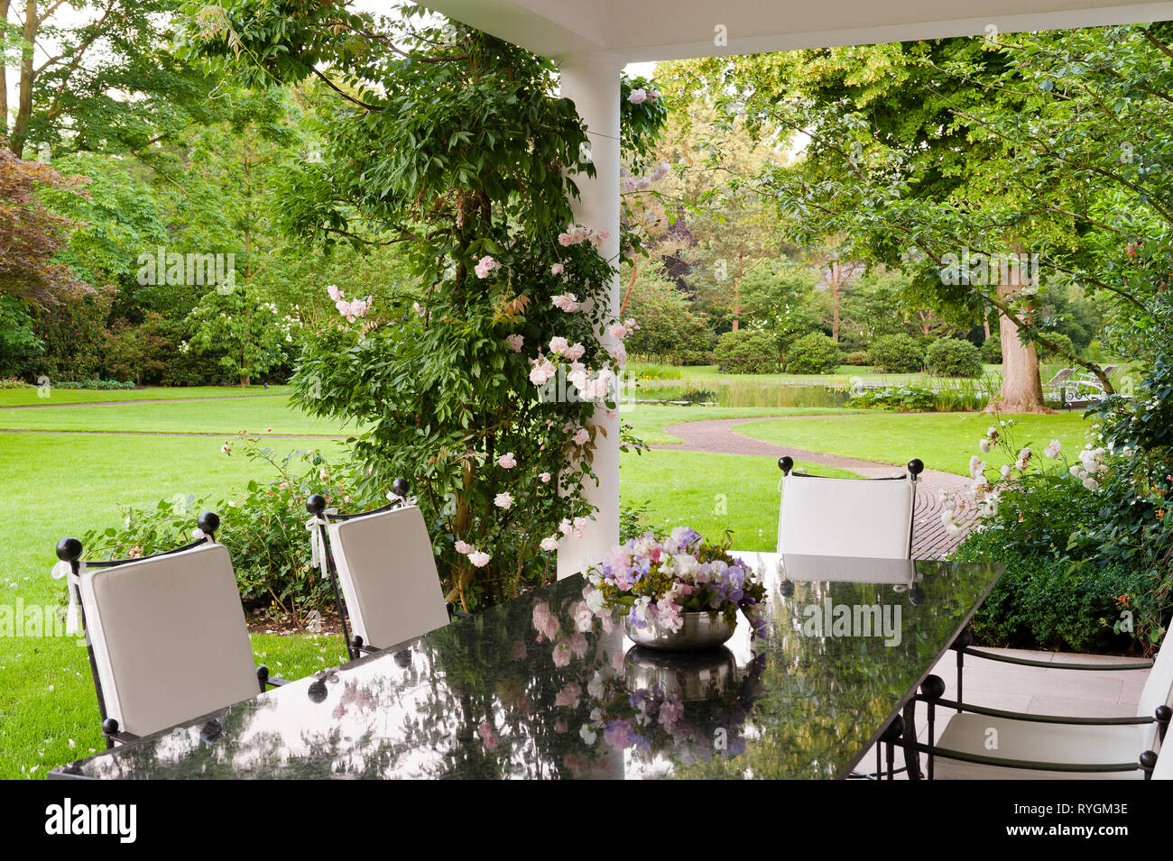 Dining area on patio Stock Photo - Alamy