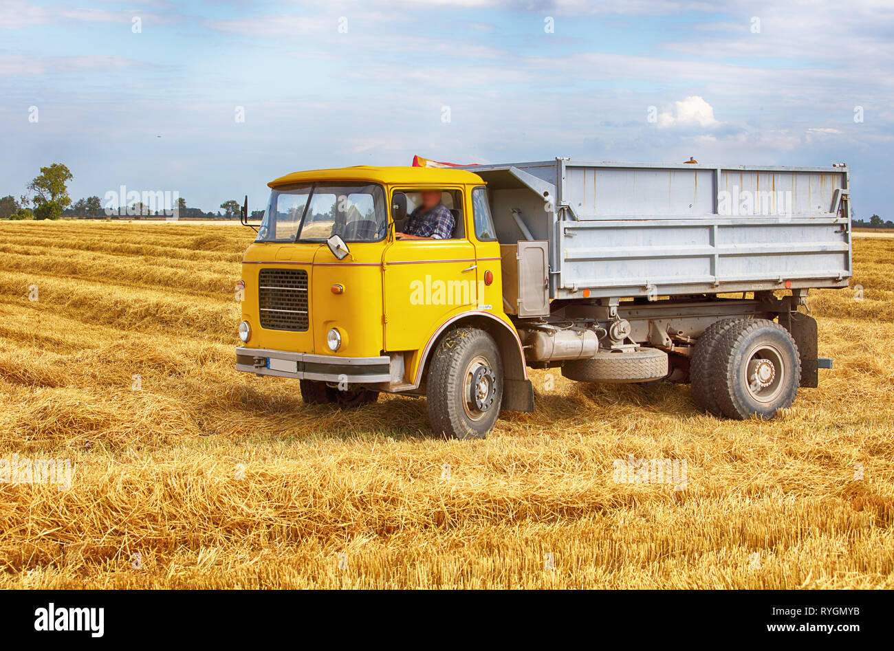Truck, lorry on field Stock Photo - Alamy