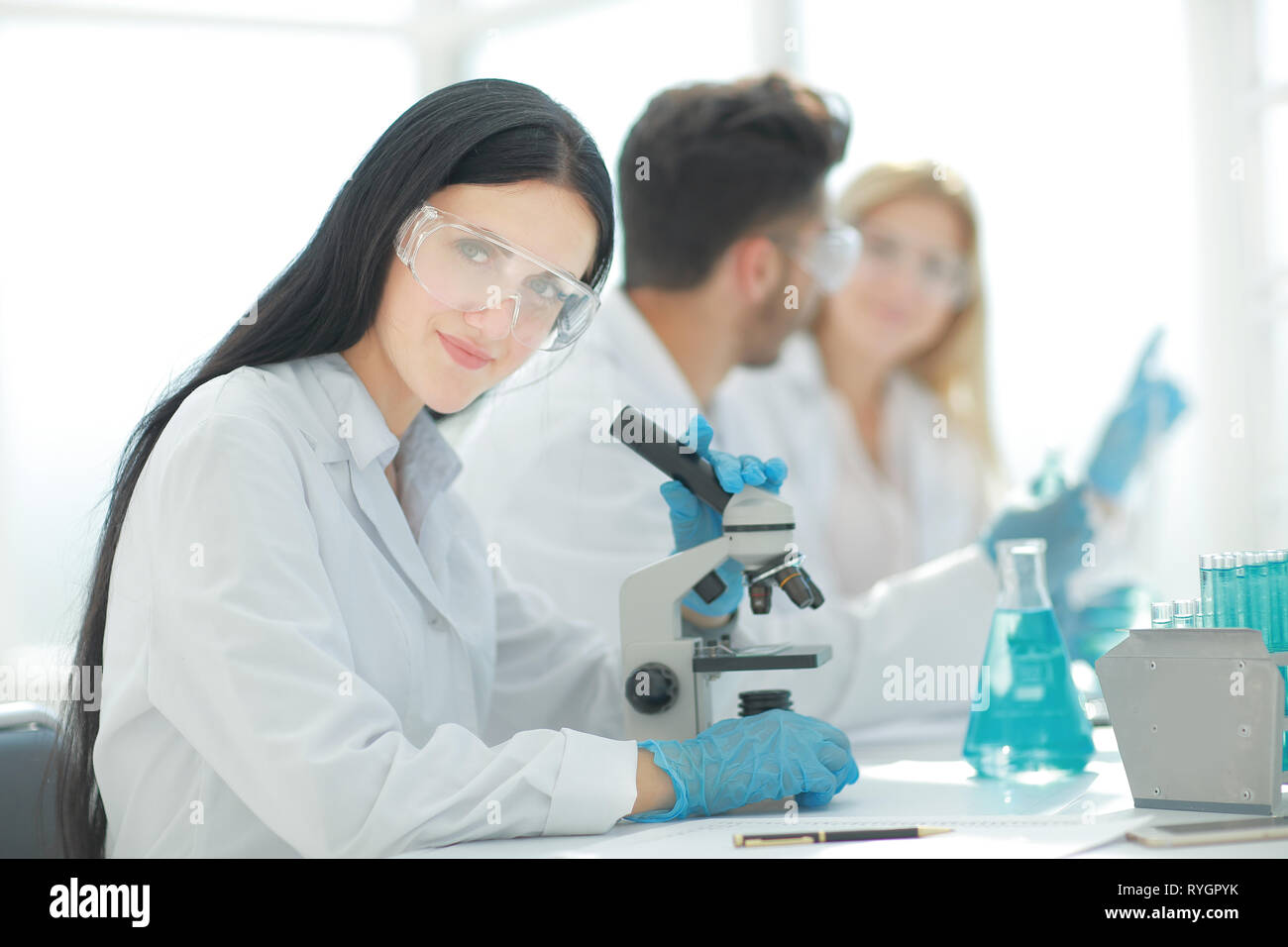 Group laboratory scientists examining hi-res stock photography and ...