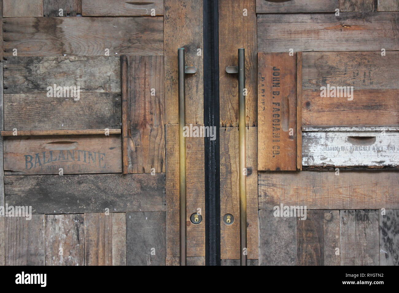 Rustic, sturdy, and heavy authentic wooden doors Stock Photo - Alamy