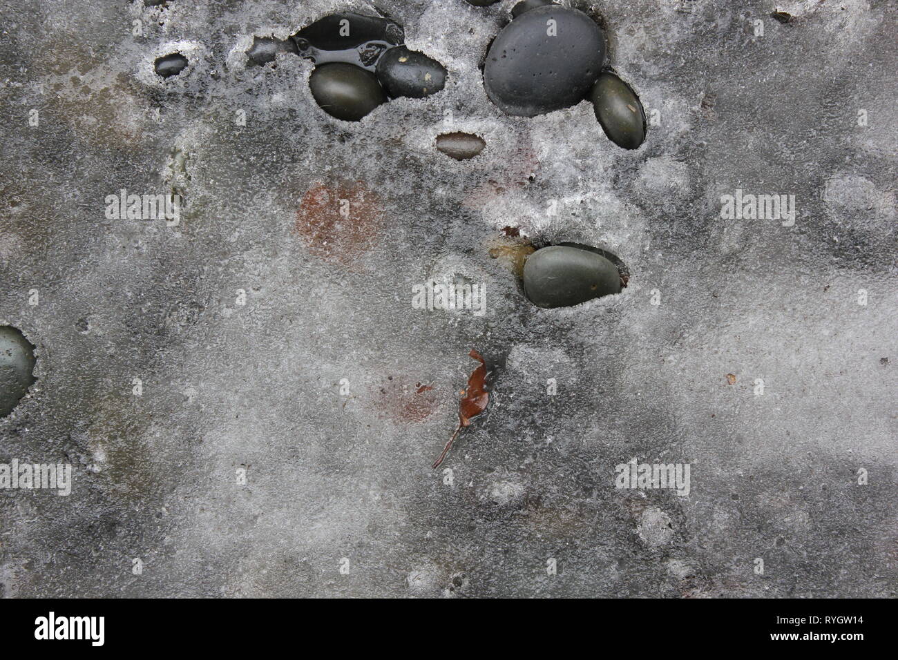 River rocks frozen in ice create a zen and and Feng shui effect Stock ...