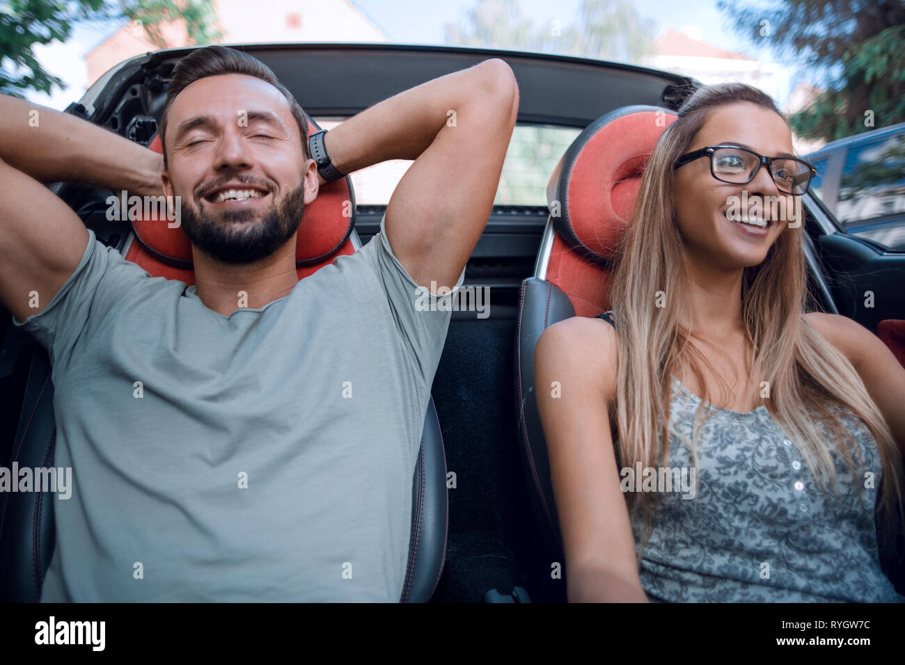 close up.young couple enjoying a trip in the car Stock Photo - Alamy