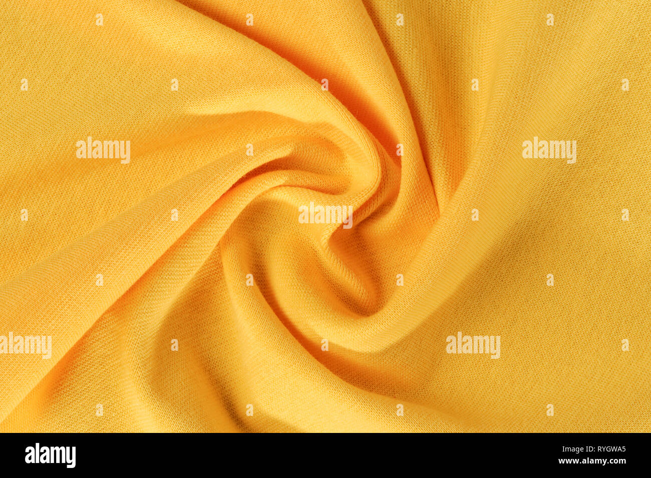 new wrinkled textile fabric yellow color Stock Photo - Alamy