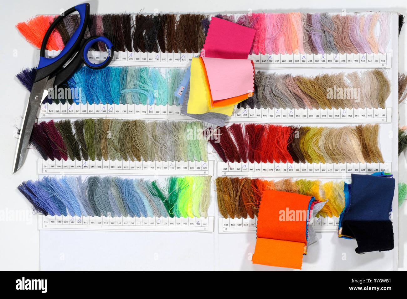 thread sample color card and fabric on white Stock Photo - Alamy