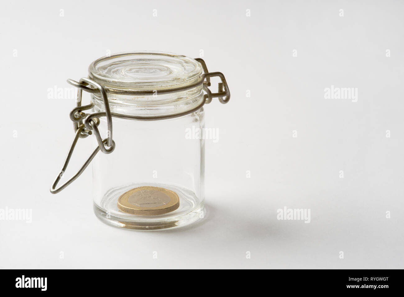 One Euro coin inside glass jar, landscape Stock Photo - Alamy