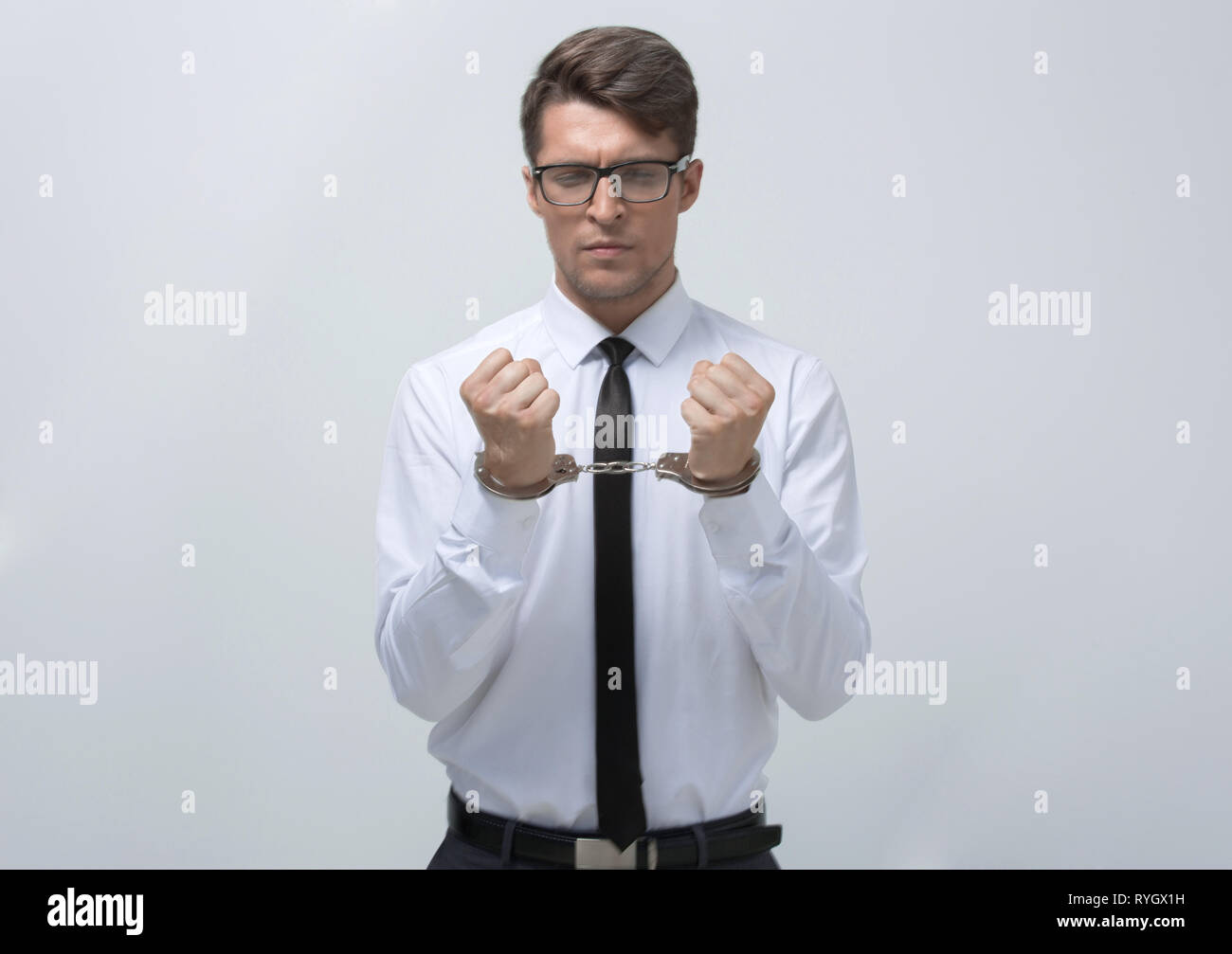 young businessman in handcuffs Stock Photo - Alamy