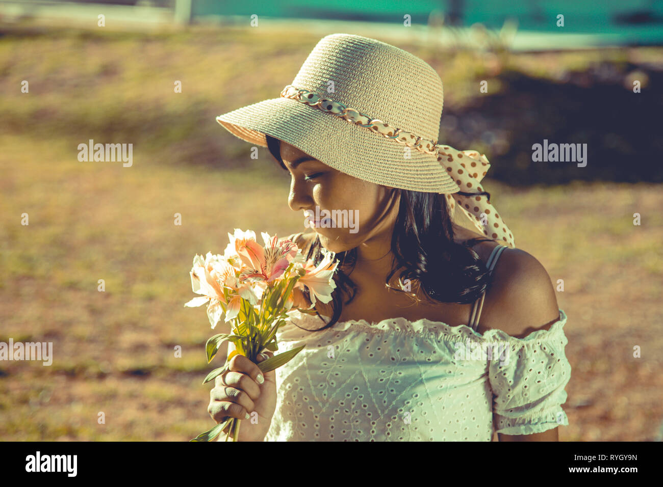 Girl modeling with flowers bouquet Stock Photo - Alamy
