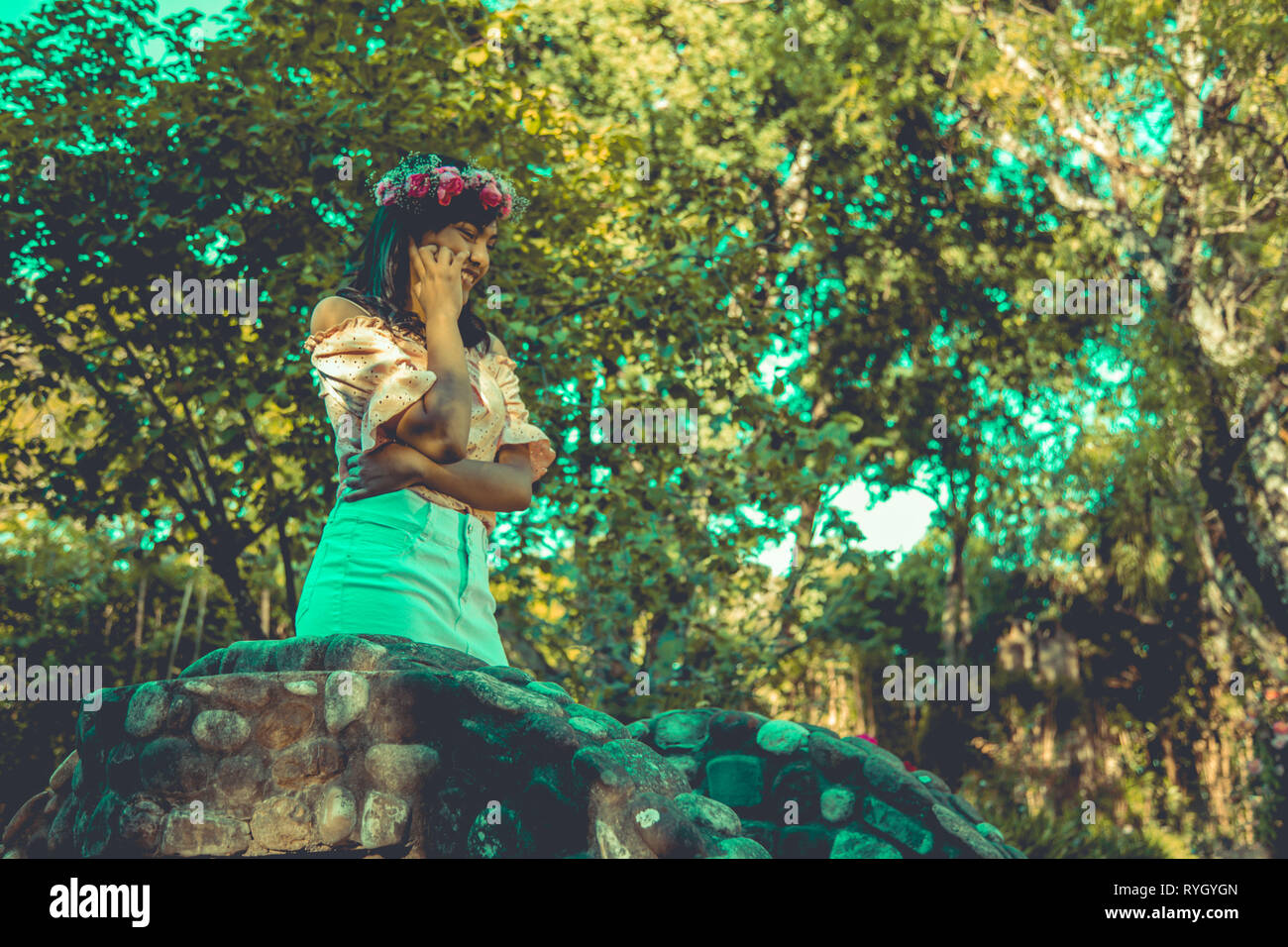 Girl modeling in a stone bridge Stock Photo - Alamy