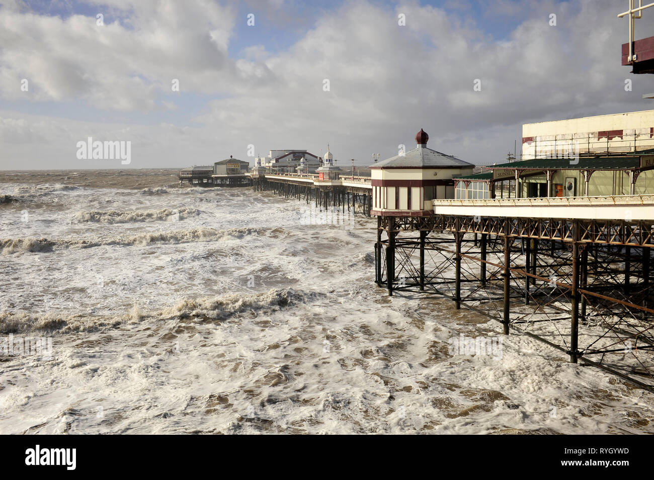 Gale force winds whip up the sea as the tide comes in under North Pier ...