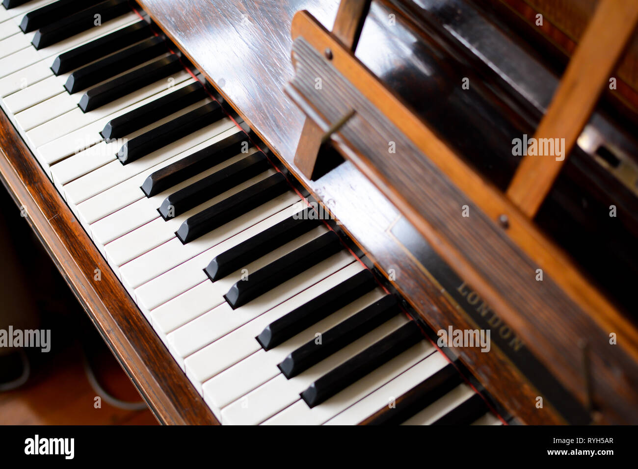Piano keyboard of a classic wooden piano Stock Photo - Alamy