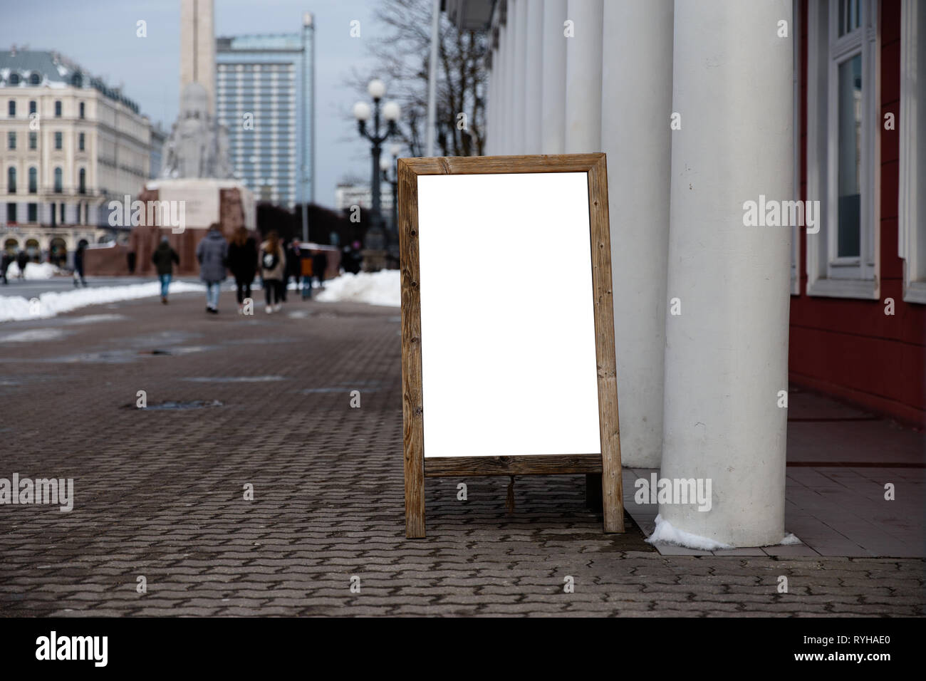Blank ad space on a wooden stand in the street outside Stock Photo - Alamy