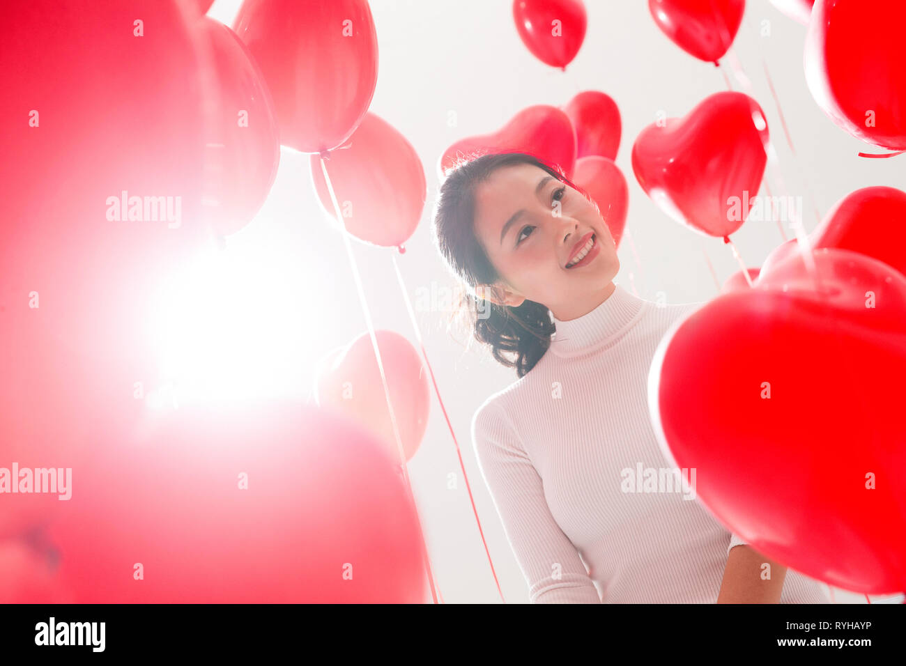 Woman with balloons floating people hi-res stock photography and images ...
