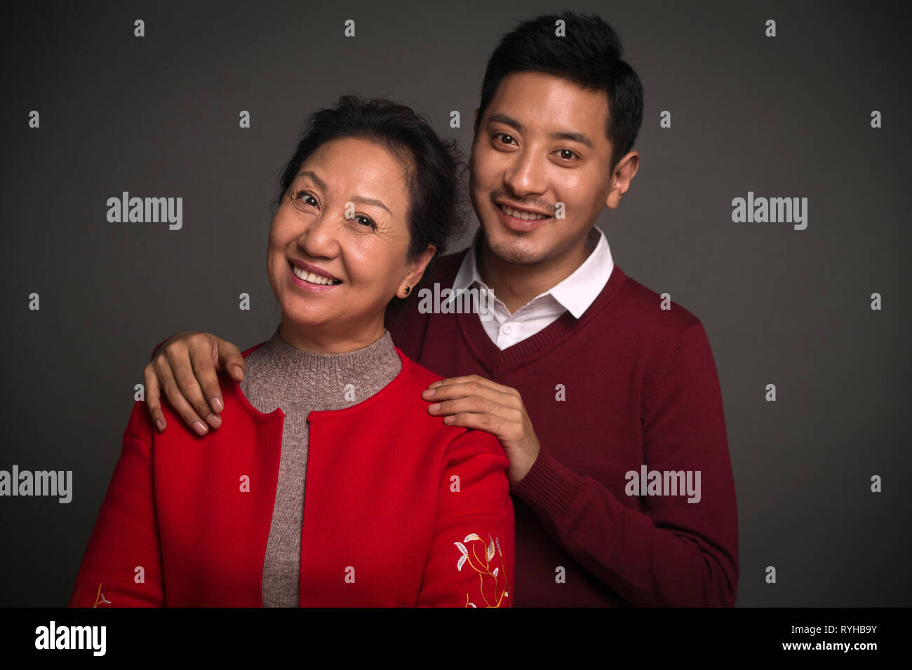 Son hug mother's shoulder Stock Photo - Alamy