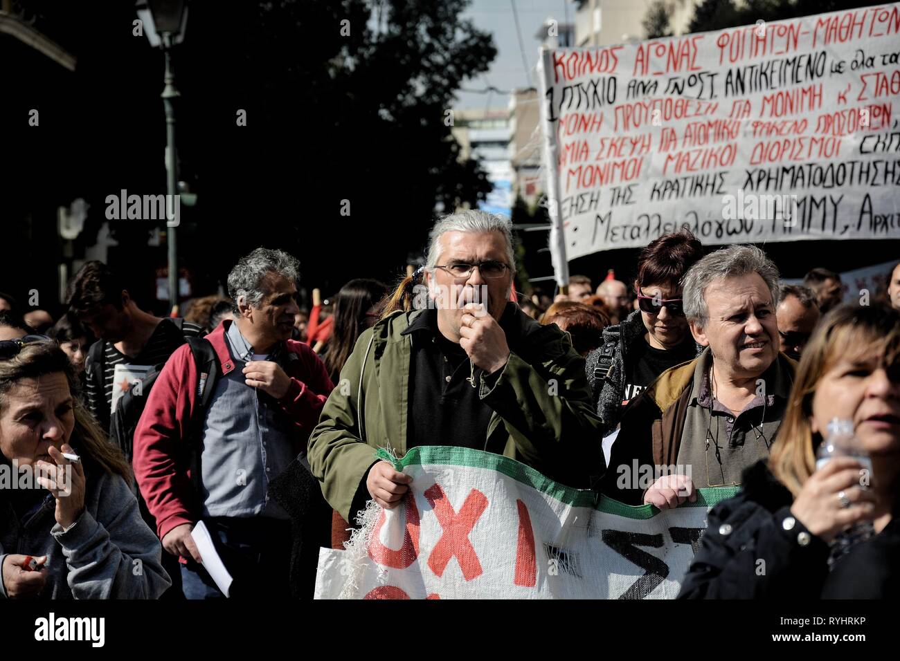 Athens, Greece. 14th Mar, 2019. Demonstrators seen blowing a whistle ...