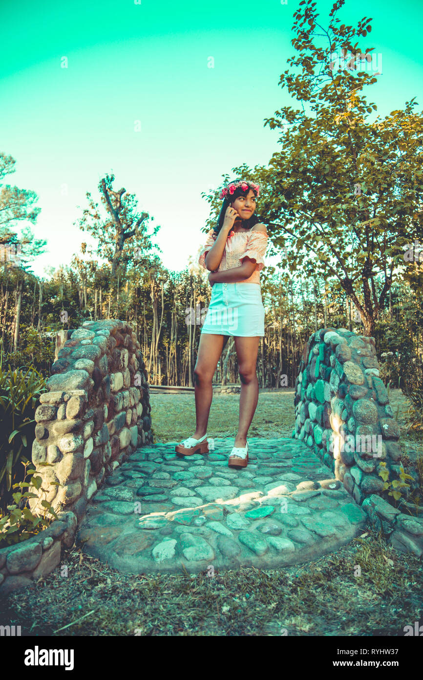 Girl modeling in a stone bridge Stock Photo - Alamy
