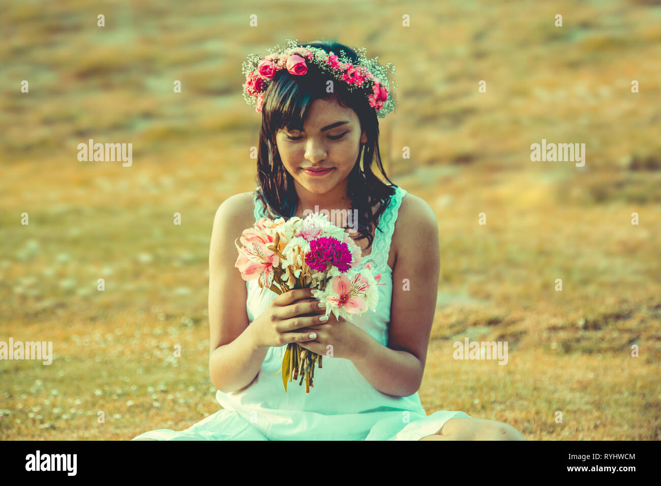 Girl modeling with flowers bouquet Stock Photo - Alamy