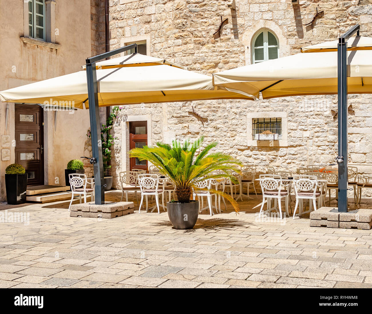 Tables in the restaurant in the open air Stock Photo - Alamy