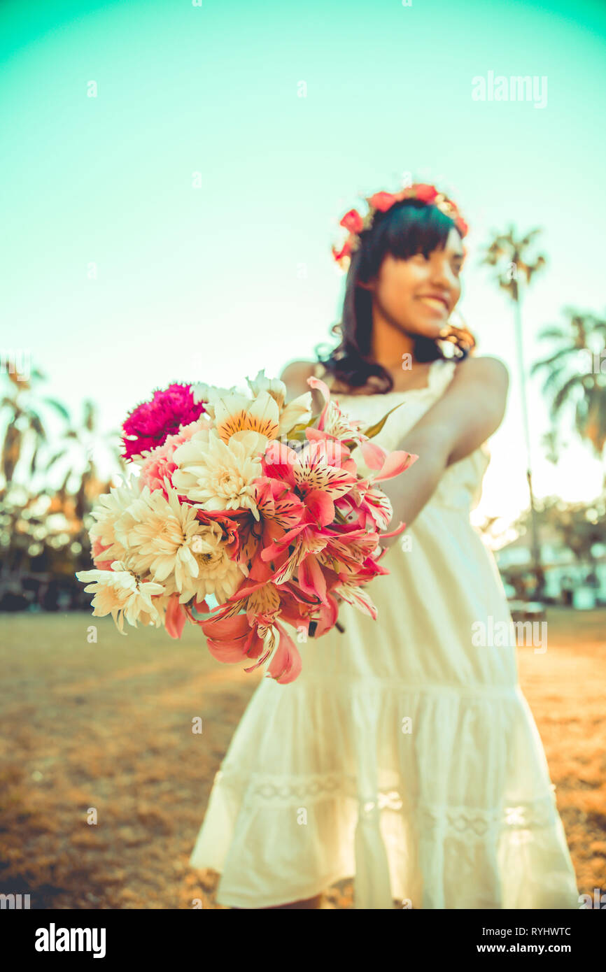 Girl modeling with flowers bouquet Stock Photo - Alamy
