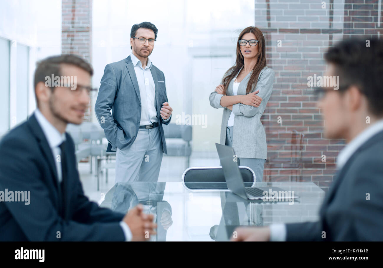 two business people talking in a Bank office Stock Photo - Alamy