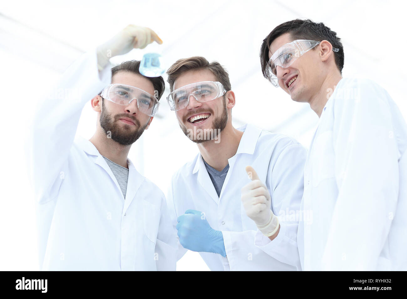 happy scientists look at the result of their work Stock Photo - Alamy