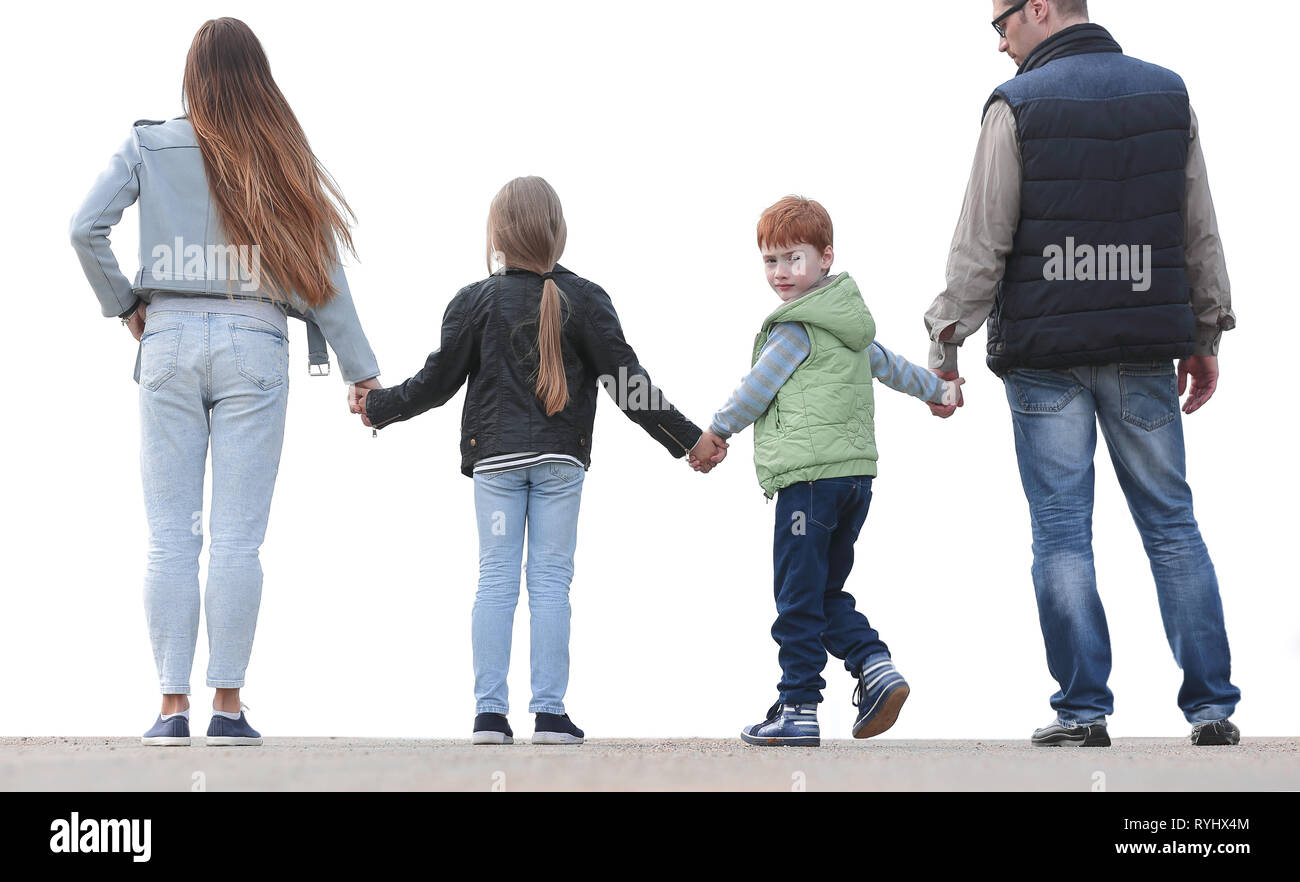 rear view . a happy family goes forward Stock Photo - Alamy
