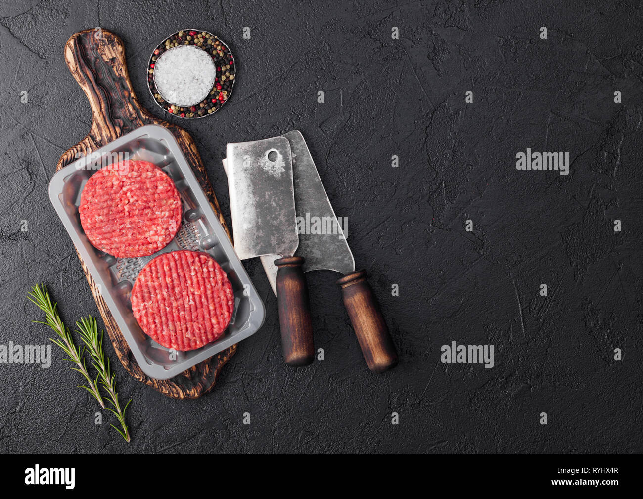 Plastic tray with raw minced homemade farmers grill beef burgers with ...