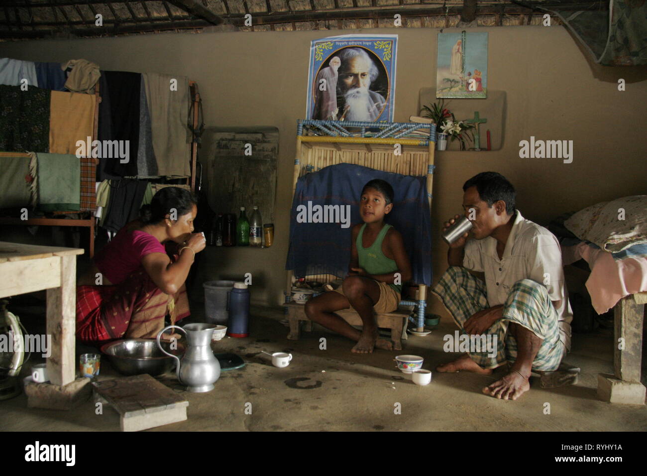 BANGLADESH Family of Garo tribal minority eating breakfast inside their ...