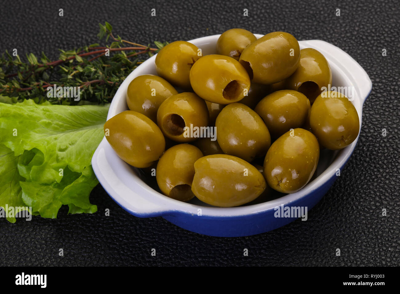 Big green olives in the bowl Stock Photo - Alamy