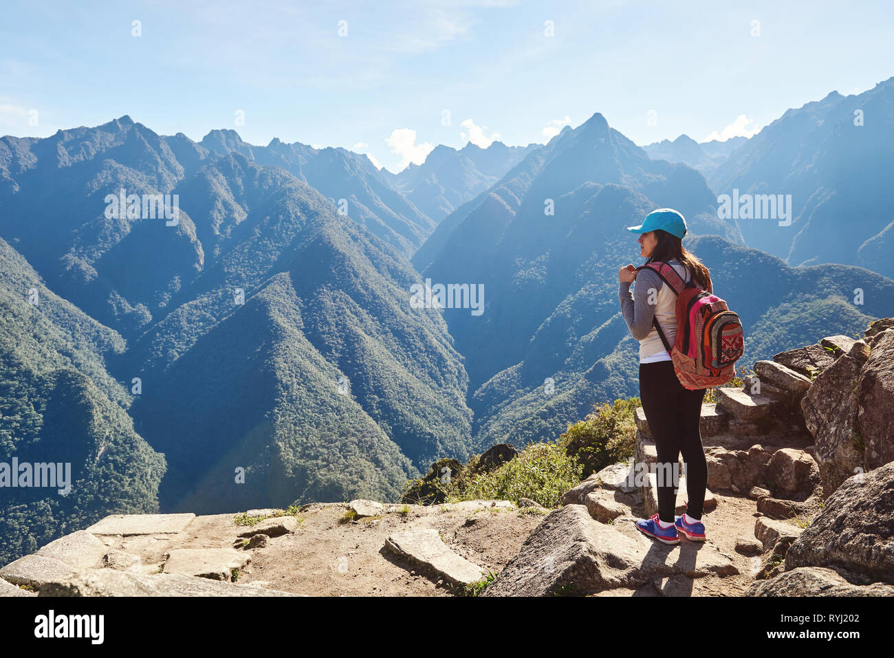 Profile of hiking woman stand on mountain cliff Stock Photo - Alamy