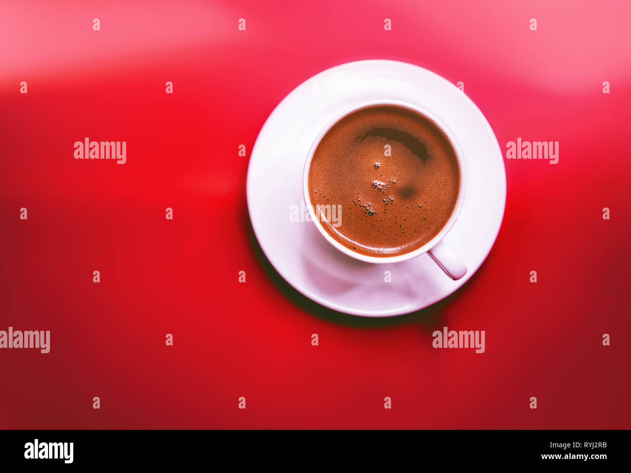 morning coffee on table - red background Stock Photo - Alamy