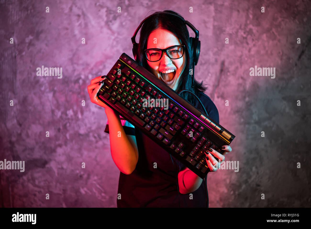 Professional Girl Gamer in MMORPG Strategy Video Game. She's She posing ...