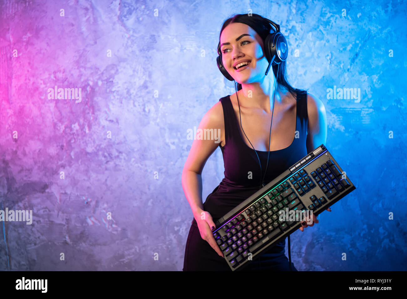 Professional Girl Gamer in MMORPG Strategy Video Game. She's She posing ...