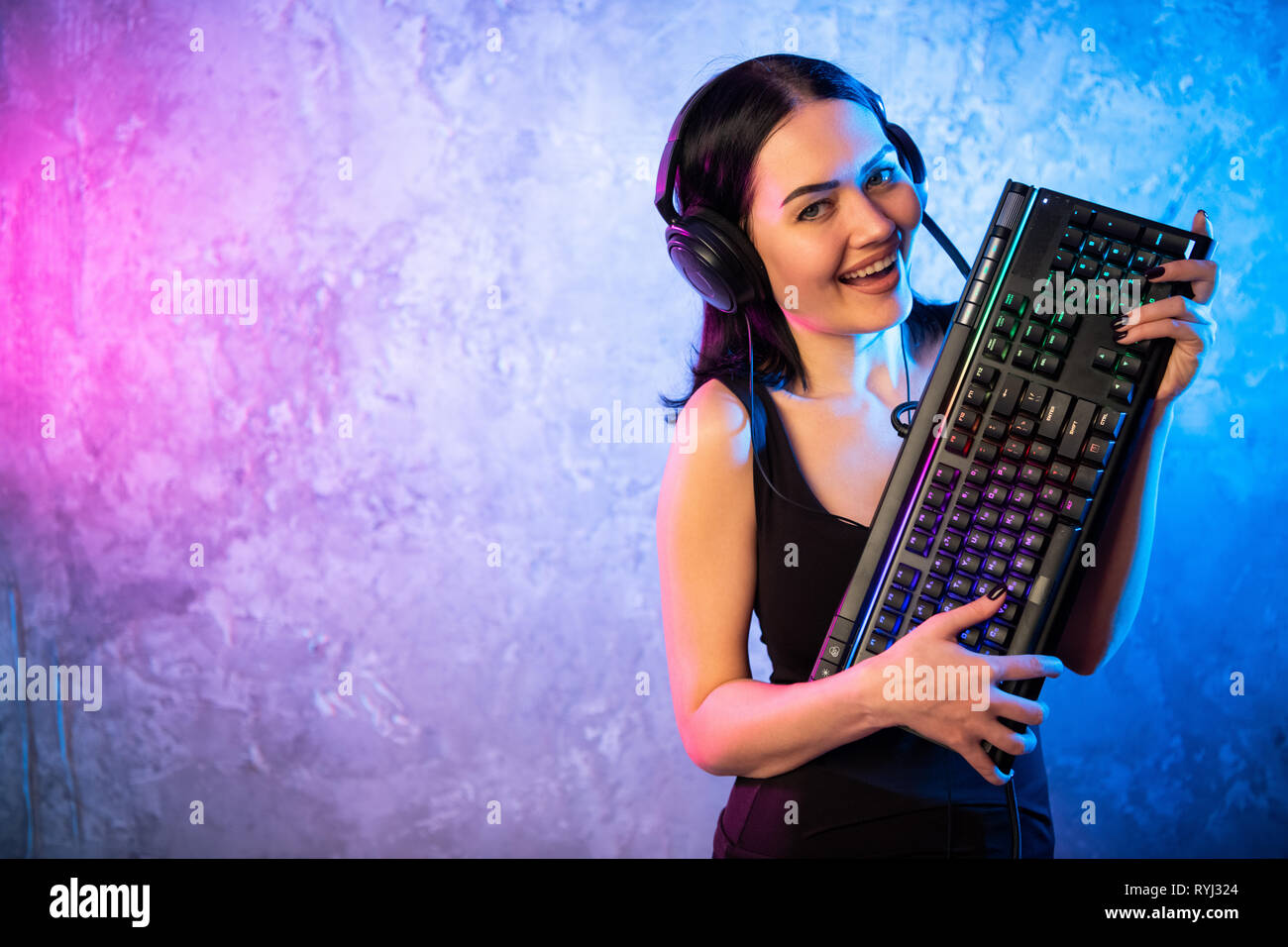 Professional Girl Gamer in MMORPG Strategy Video Game. She's She posing ...