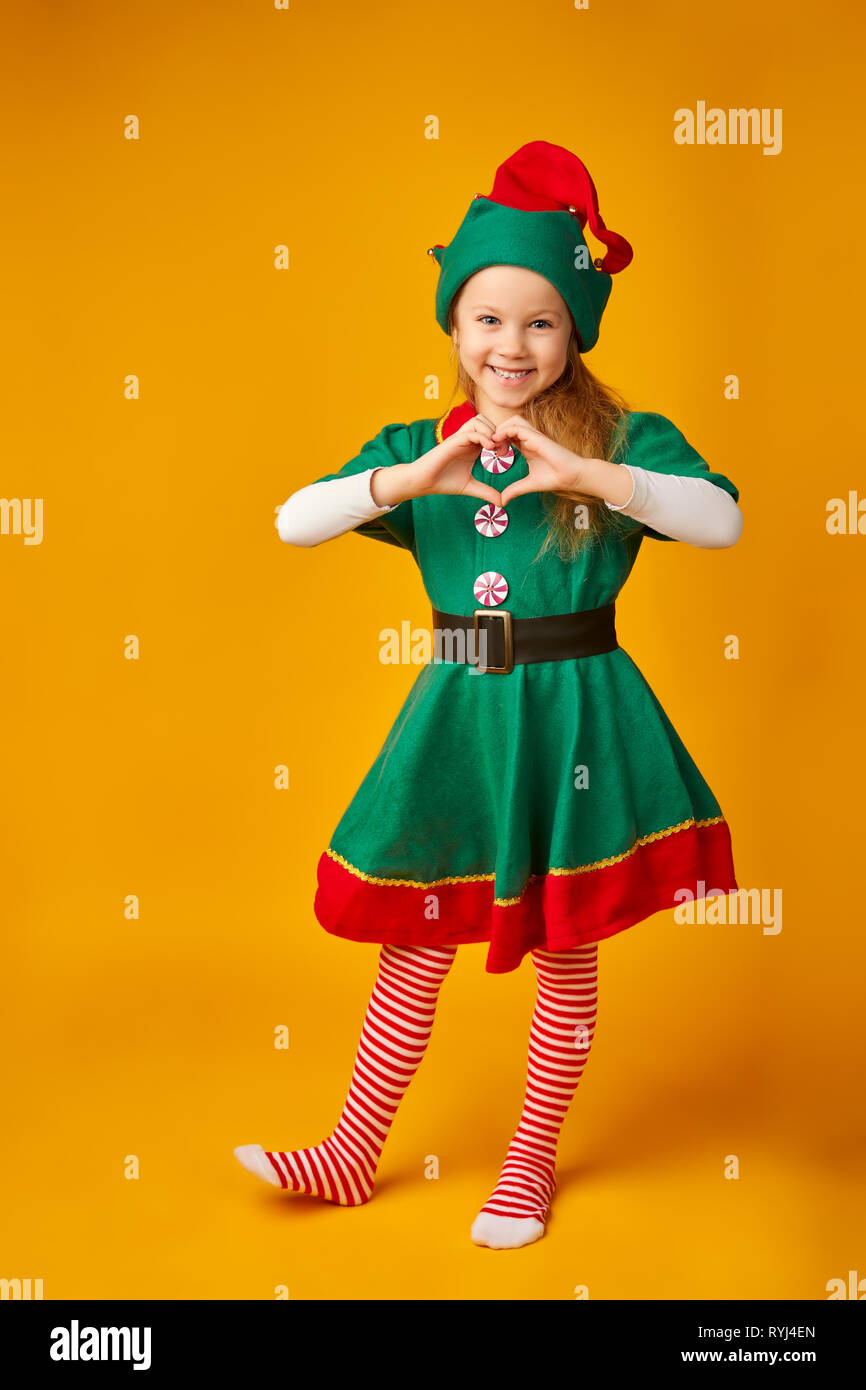 girl elf showing heart with hands Stock Photo - Alamy