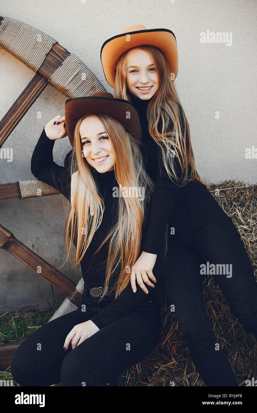 Girls in a cowboys hat on a ranch Stock Photo - Alamy