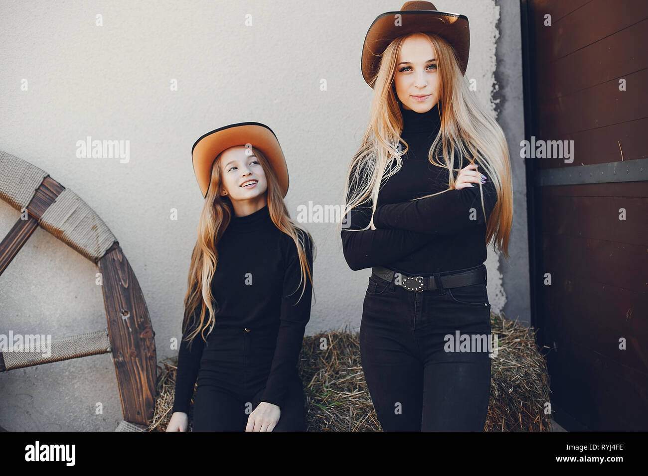 Girls in a cowboys hat on a ranch Stock Photo - Alamy