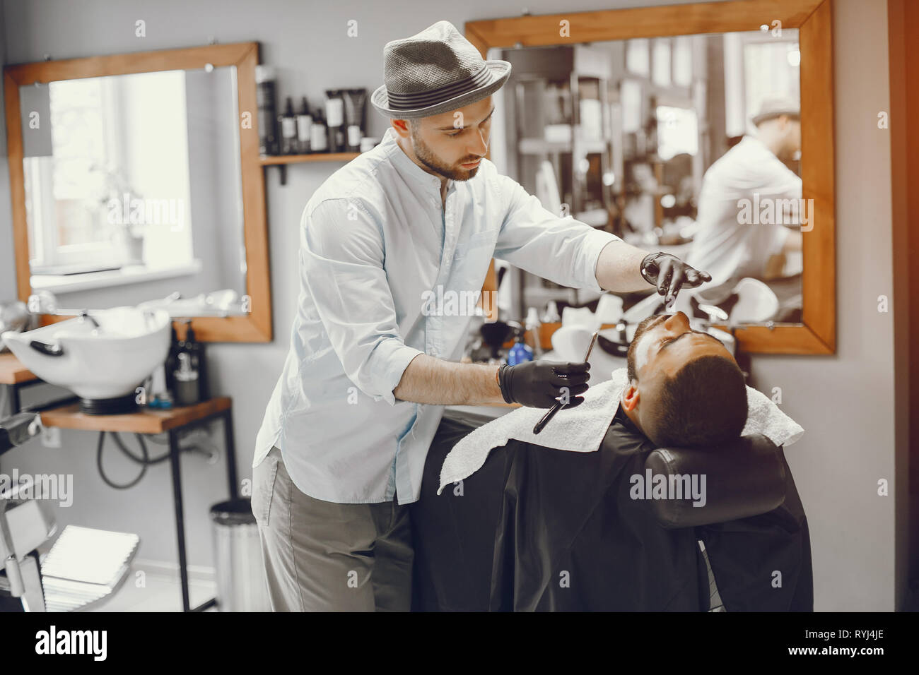 The man cuts his beard in the barbershop Stock Photo - Alamy