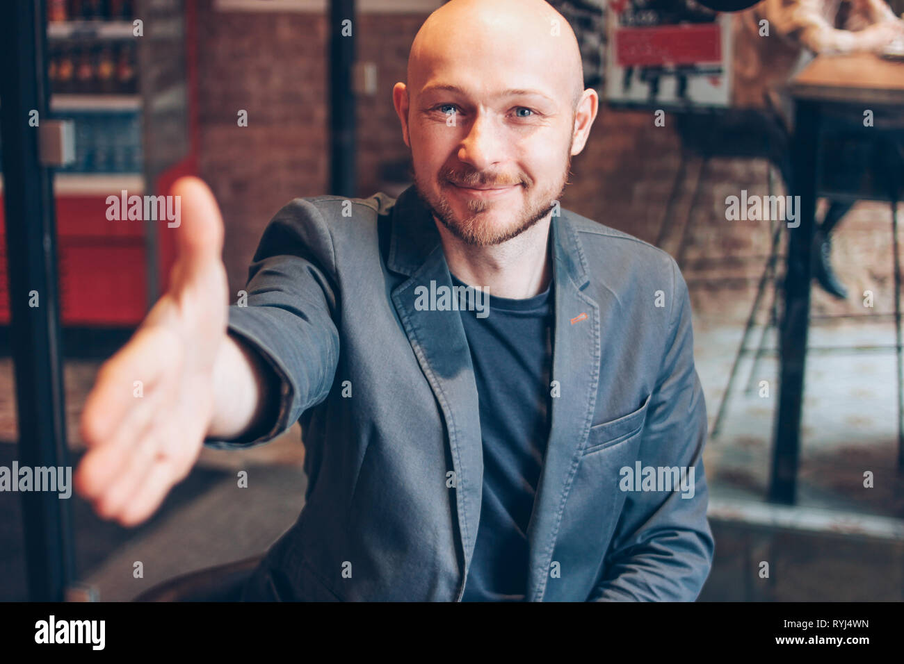 Smiling Attractive Adult Successful Bald Bearded Man In Suit With