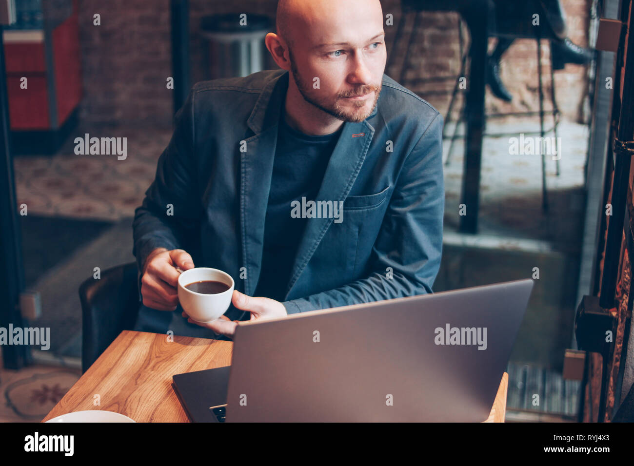 Thinking Attractive Adult Successful Bald Bearded Man In Suit With