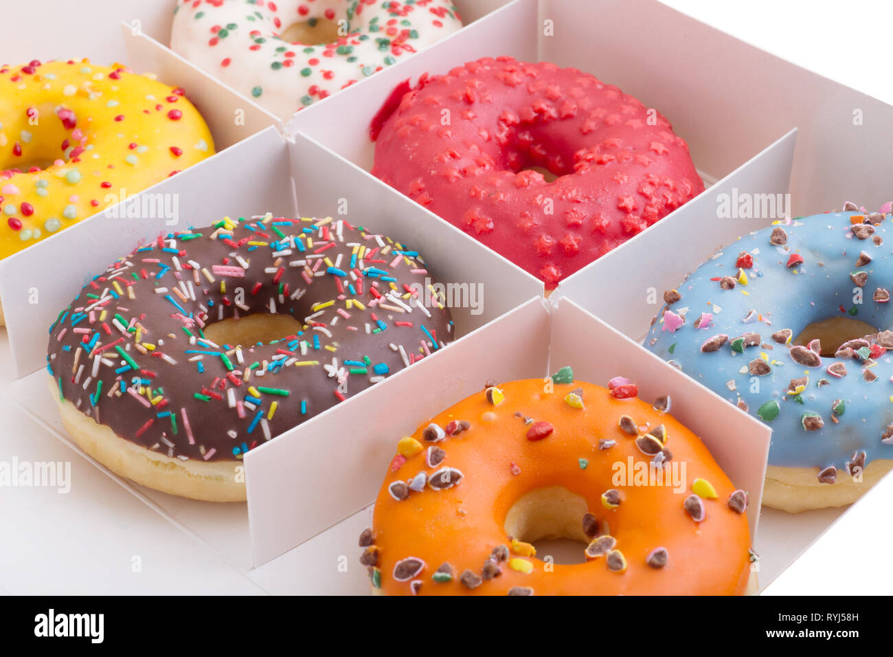 Set of donuts of various colors in box Stock Photo - Alamy