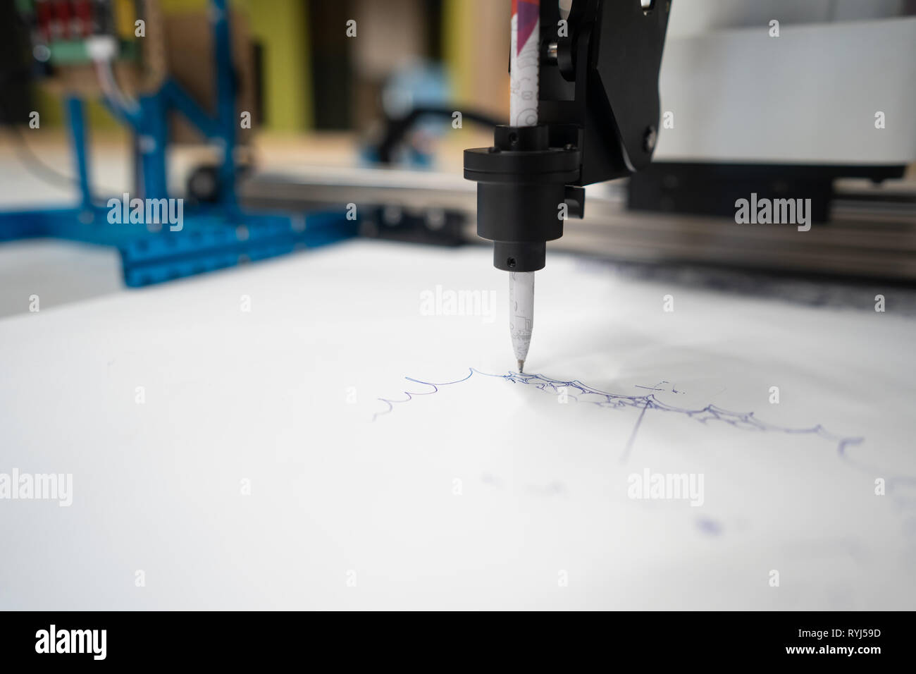 Plotter draws a pen drawing on a sheet of white paper Stock Photo - Alamy