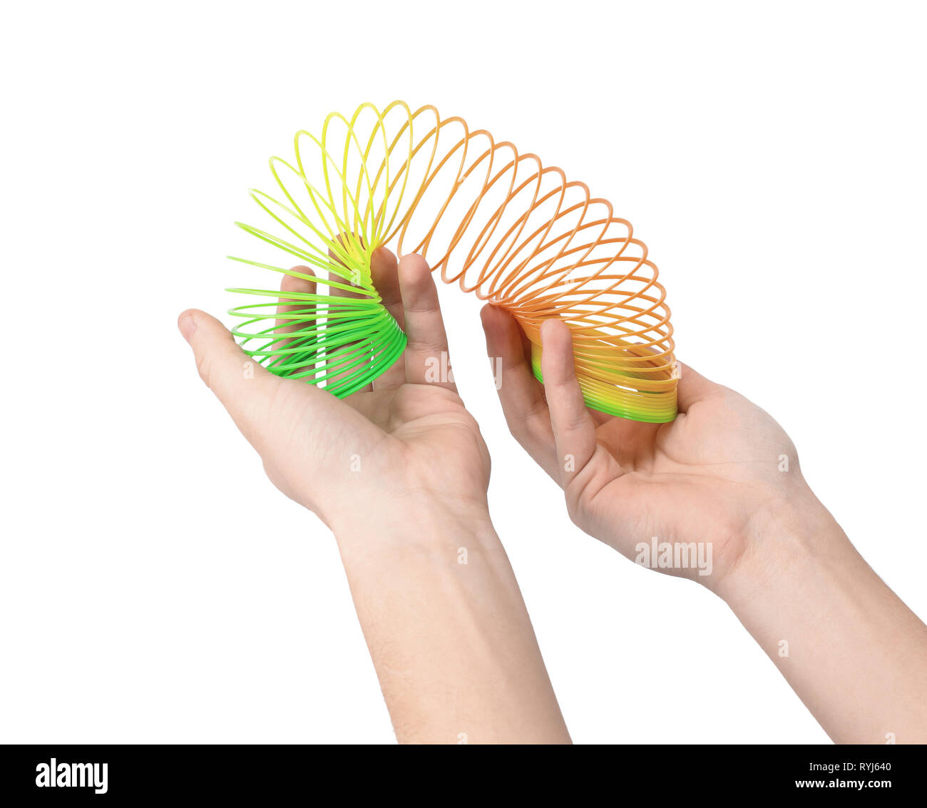 close up.toy spiral in female hands.isolated on white Stock Photo - Alamy