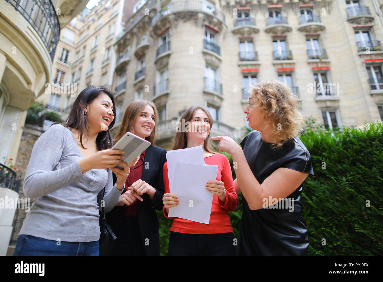 International students paying by tablet with card in with university ...